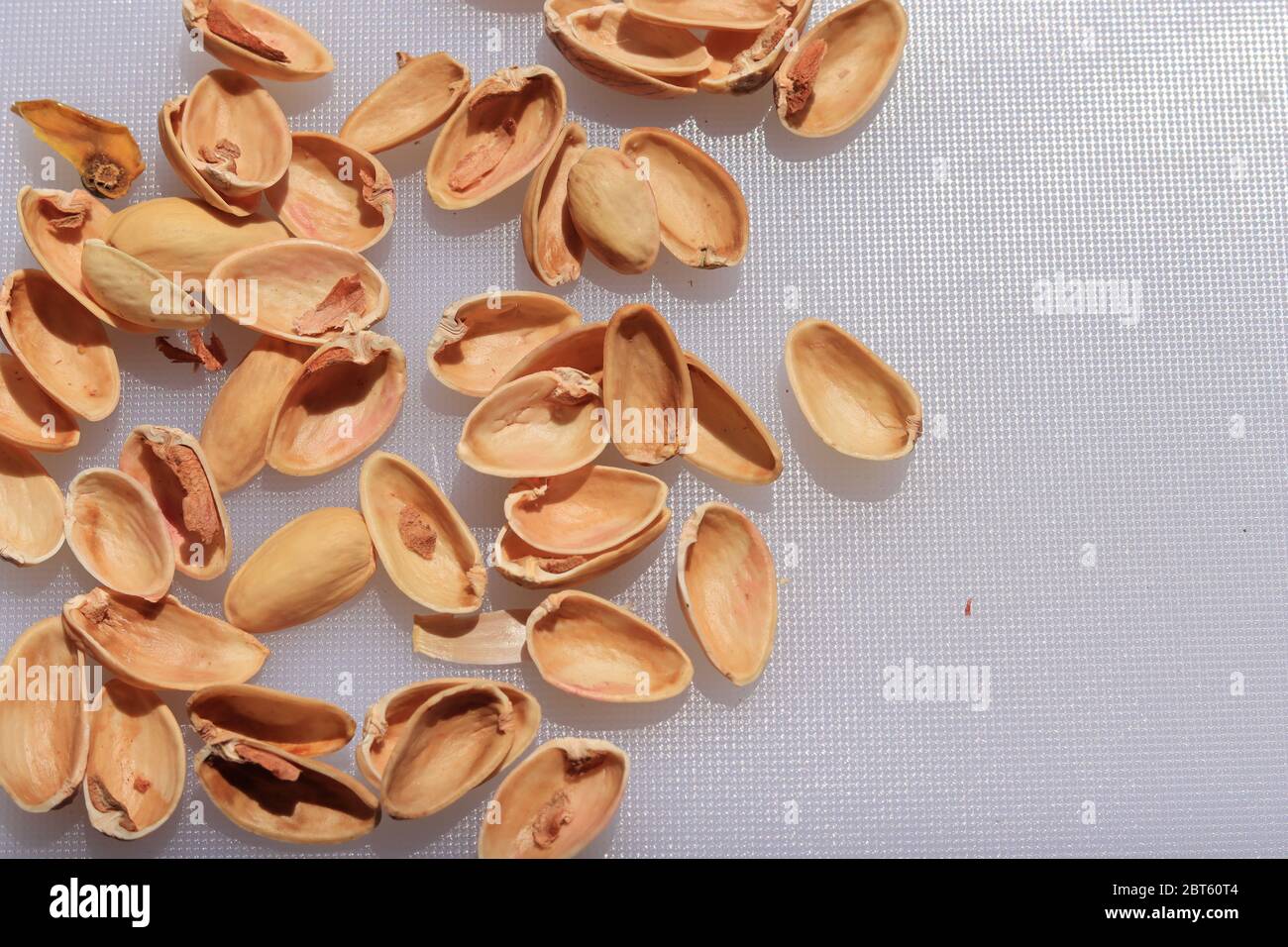 Pistachios shells isolated on white background Stock Photo - Alamy
