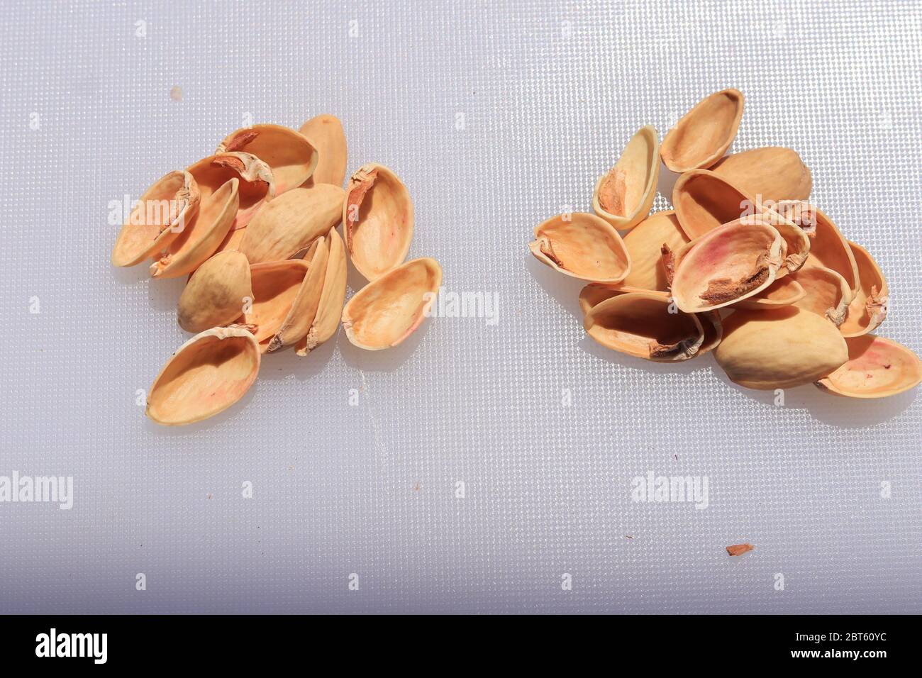 Pistachios shells isolated on white background Stock Photo - Alamy