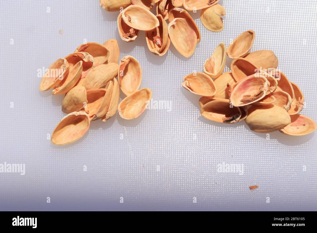 Pistachios shells isolated on white background Stock Photo - Alamy