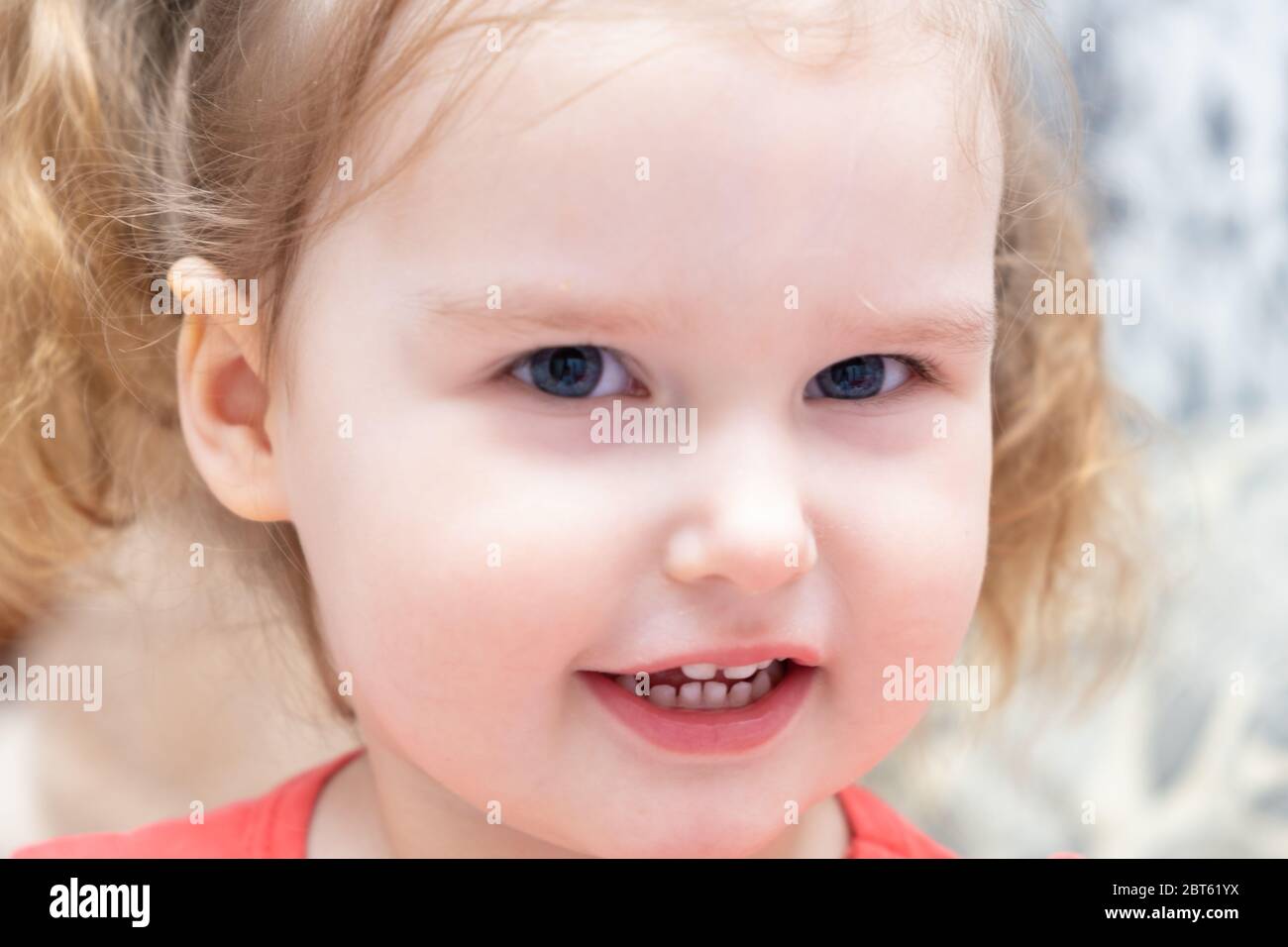 Portrait of a cute happy 2 year old girl Stock Photo - Alamy