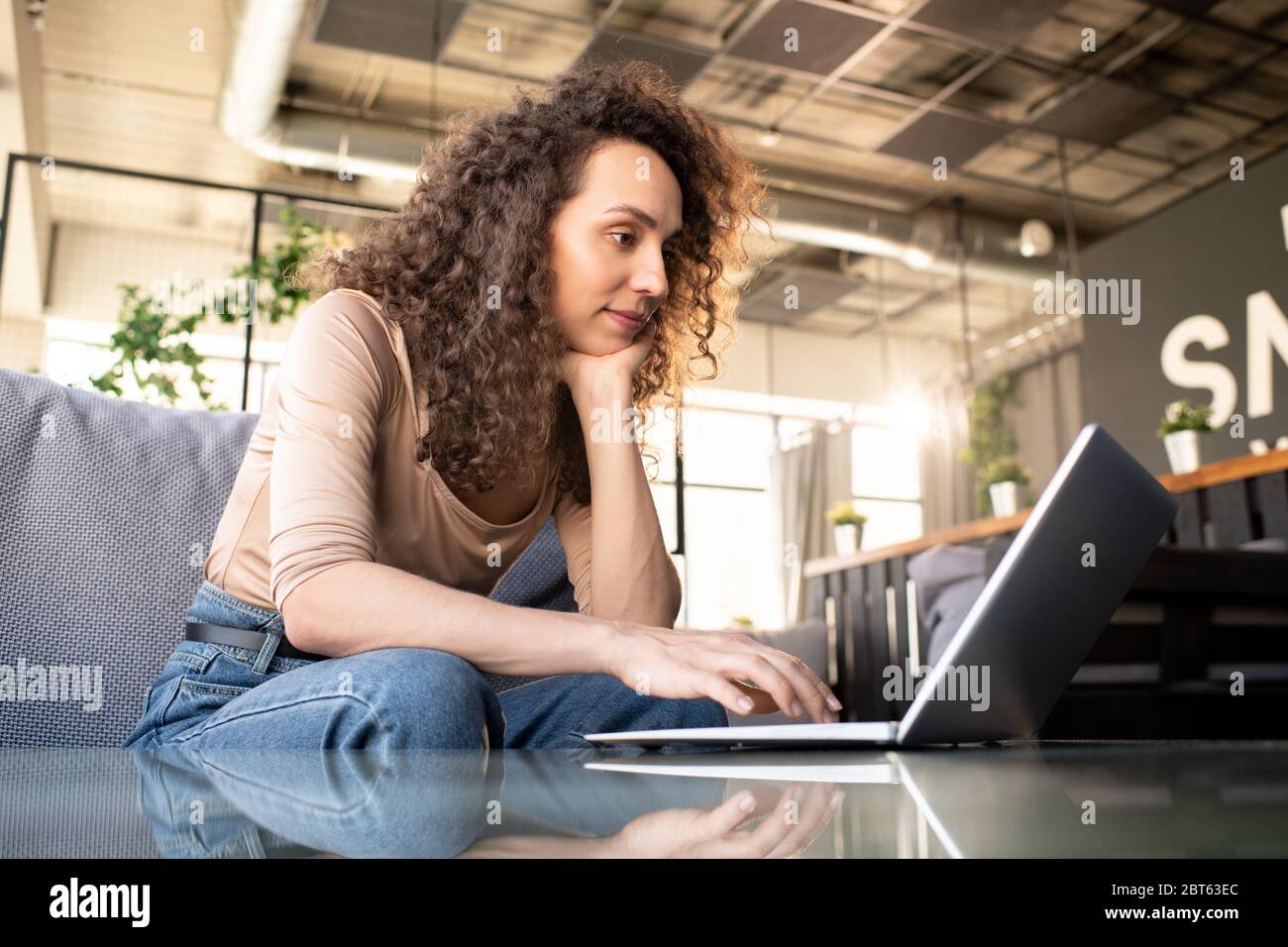 Woman bending over table hi-res stock photography and images - Alamy