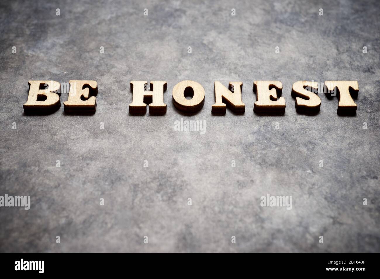 Be honest text on a gray paper Stock Photo - Alamy