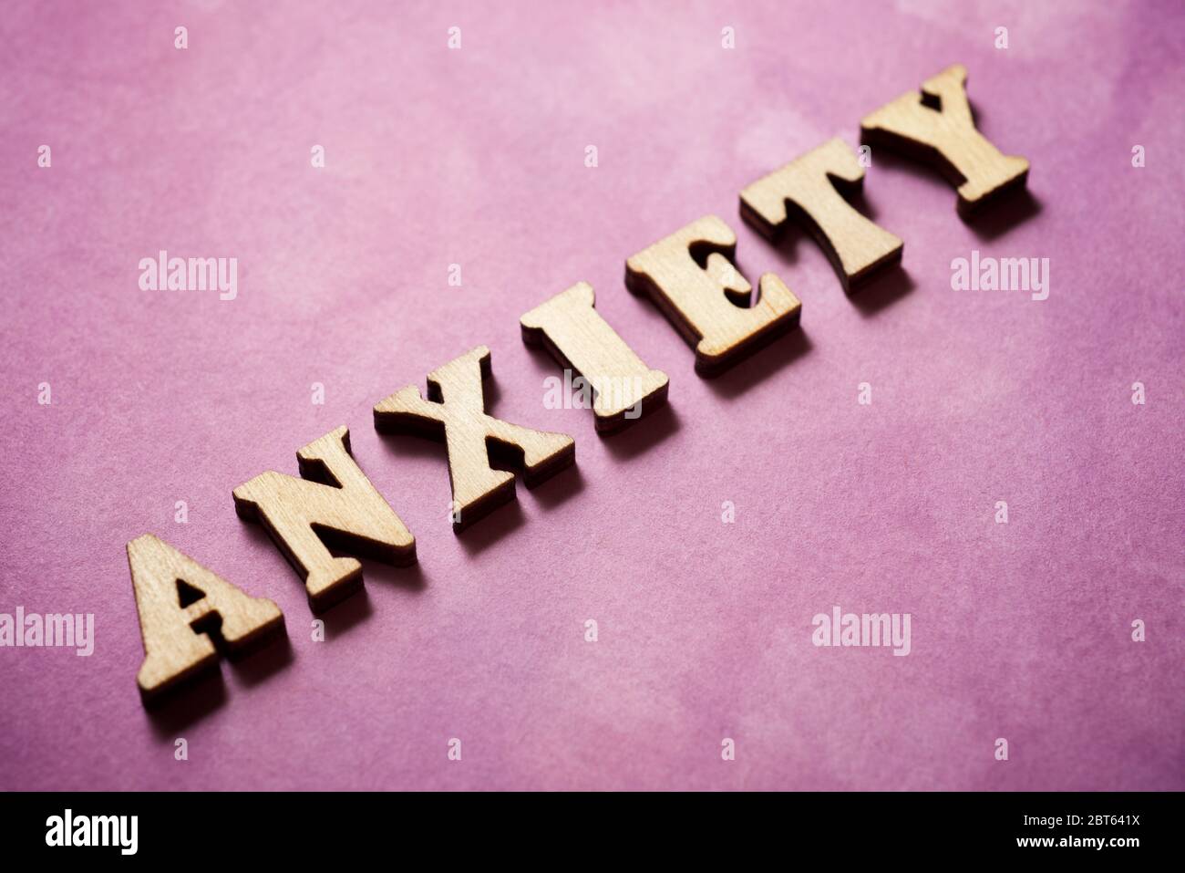 Anxiety text on a colored paper Stock Photo - Alamy