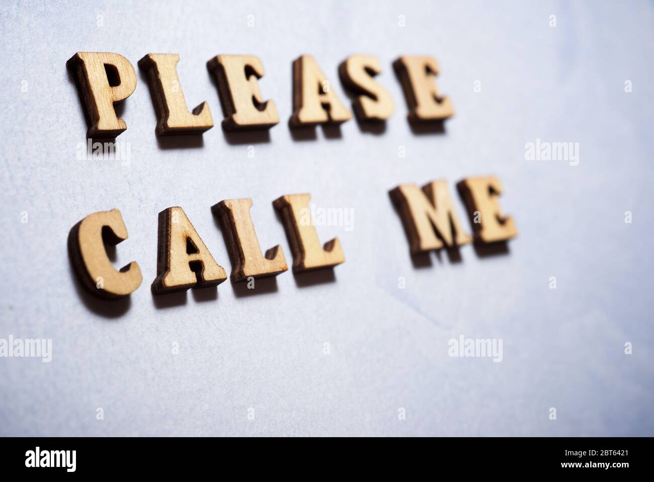 Please Call me text in a colored paper Stock Photo - Alamy