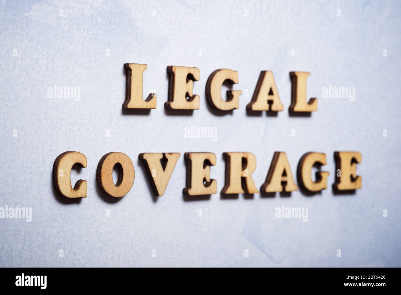 Legal coverage text in a colored paper Stock Photo - Alamy