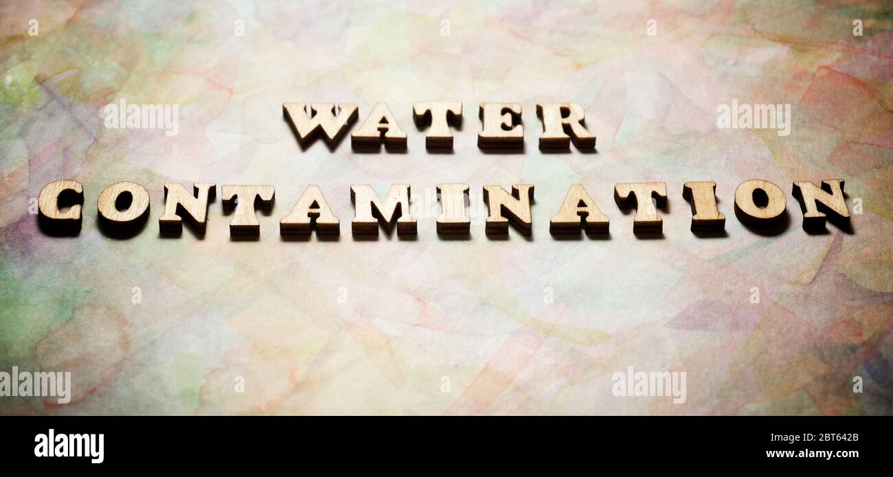 Water Contamination text in a colored paper Stock Photo - Alamy