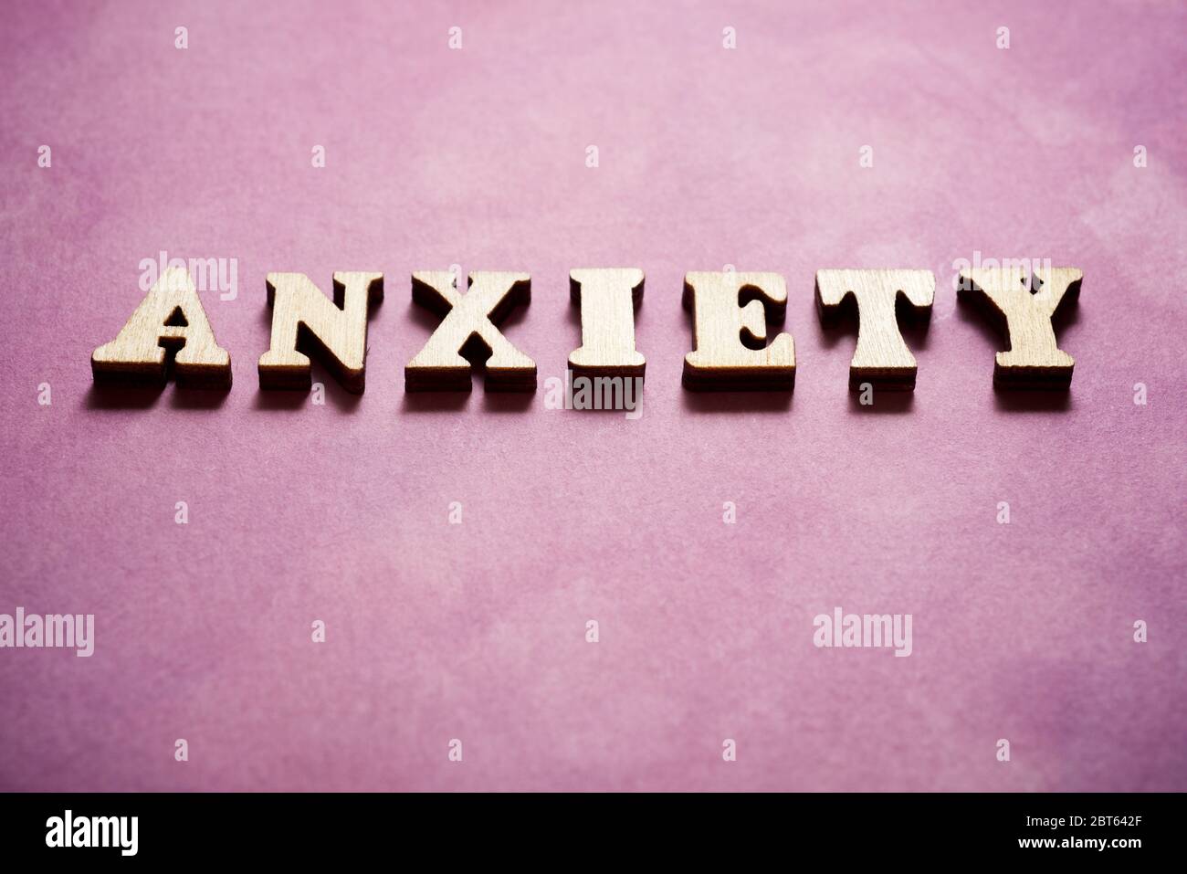 Anxiety text on a colored paper Stock Photo - Alamy