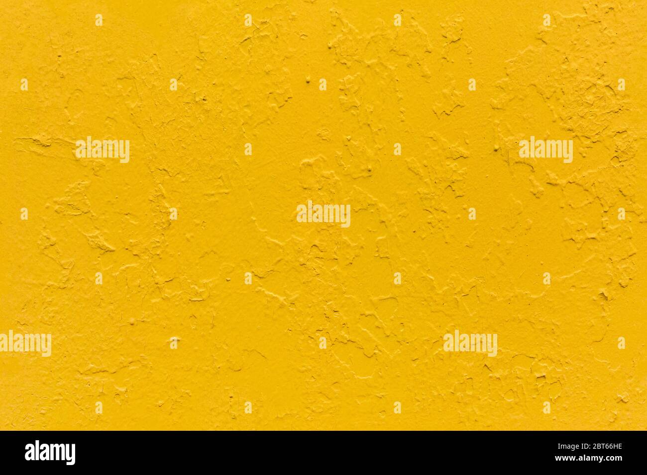 seamless texture of flat thick painted yellow surface under direct ...
