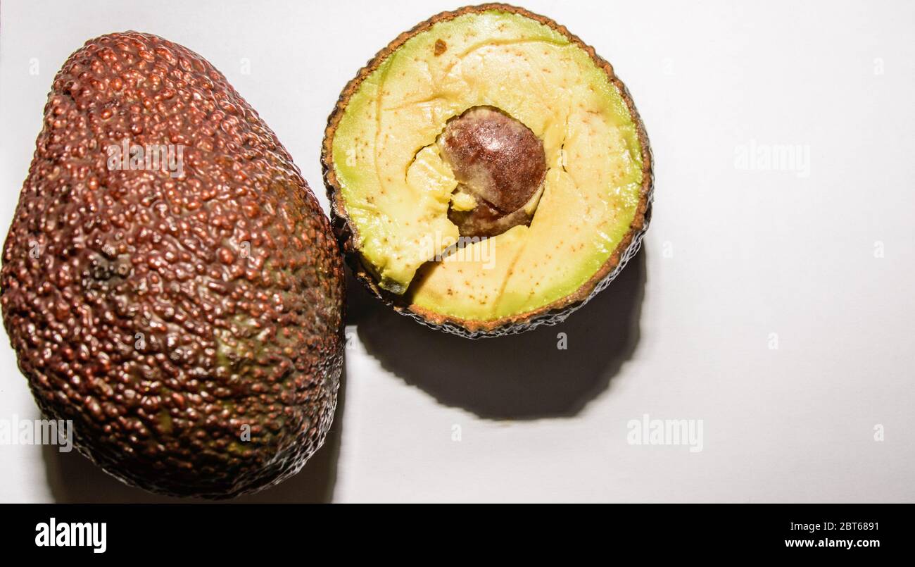 Open half of avocado hi-res stock photography and images - Alamy