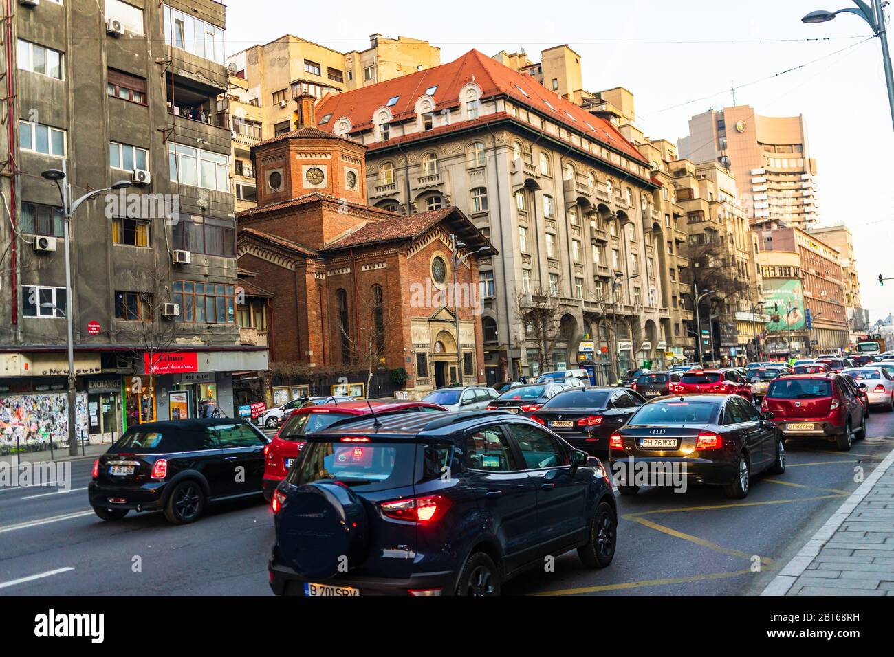 Car traffic at rush hour in downtown area of the city. Car pollution ...