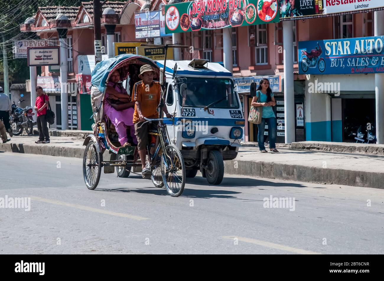 Nepal, Kathmandu, Colourful street scenes with rick-shaw taxi drivers ...