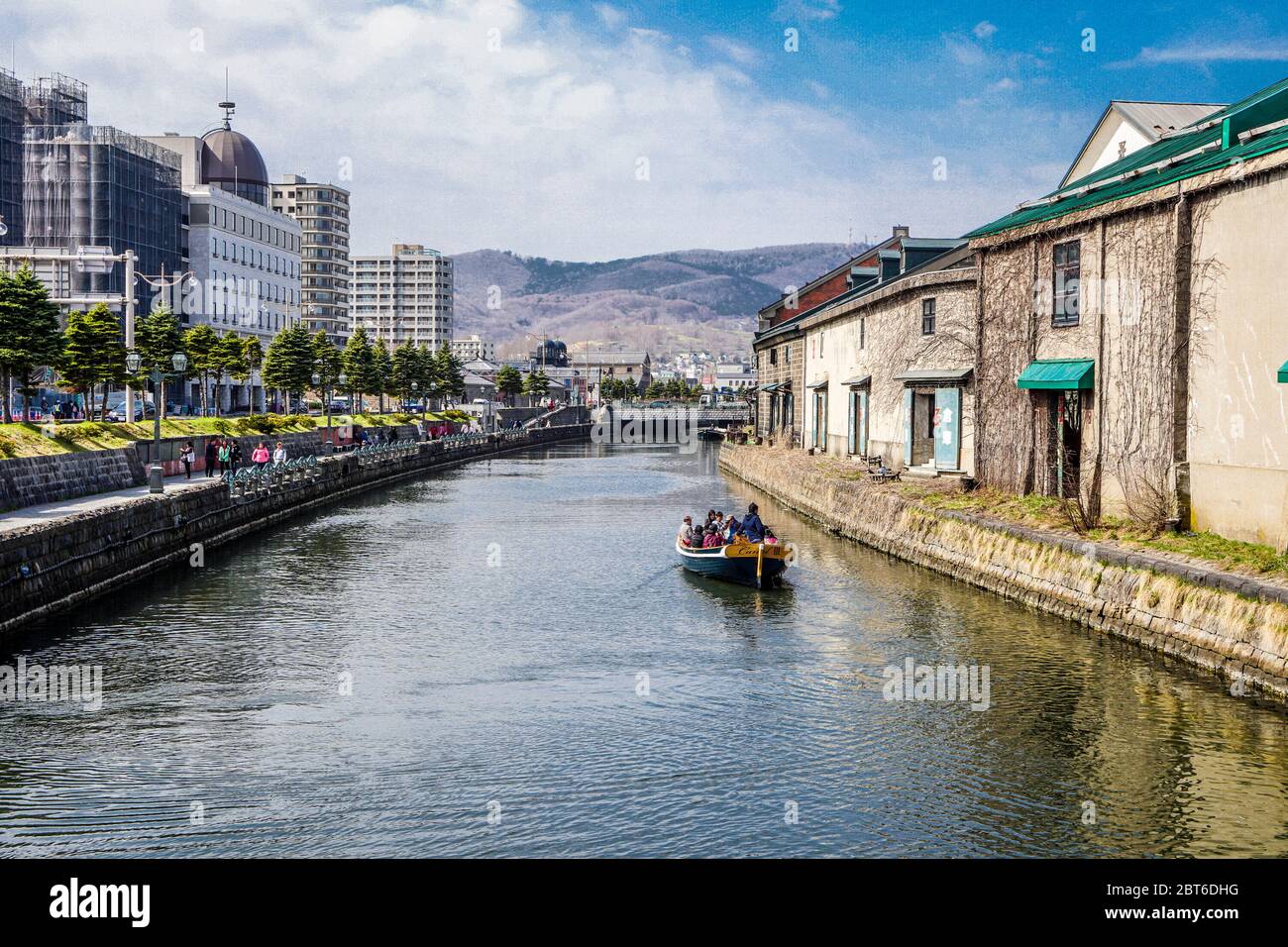 Tourists taking a boat ride along the famous Otaru Canal, or Otaru Unga ...
