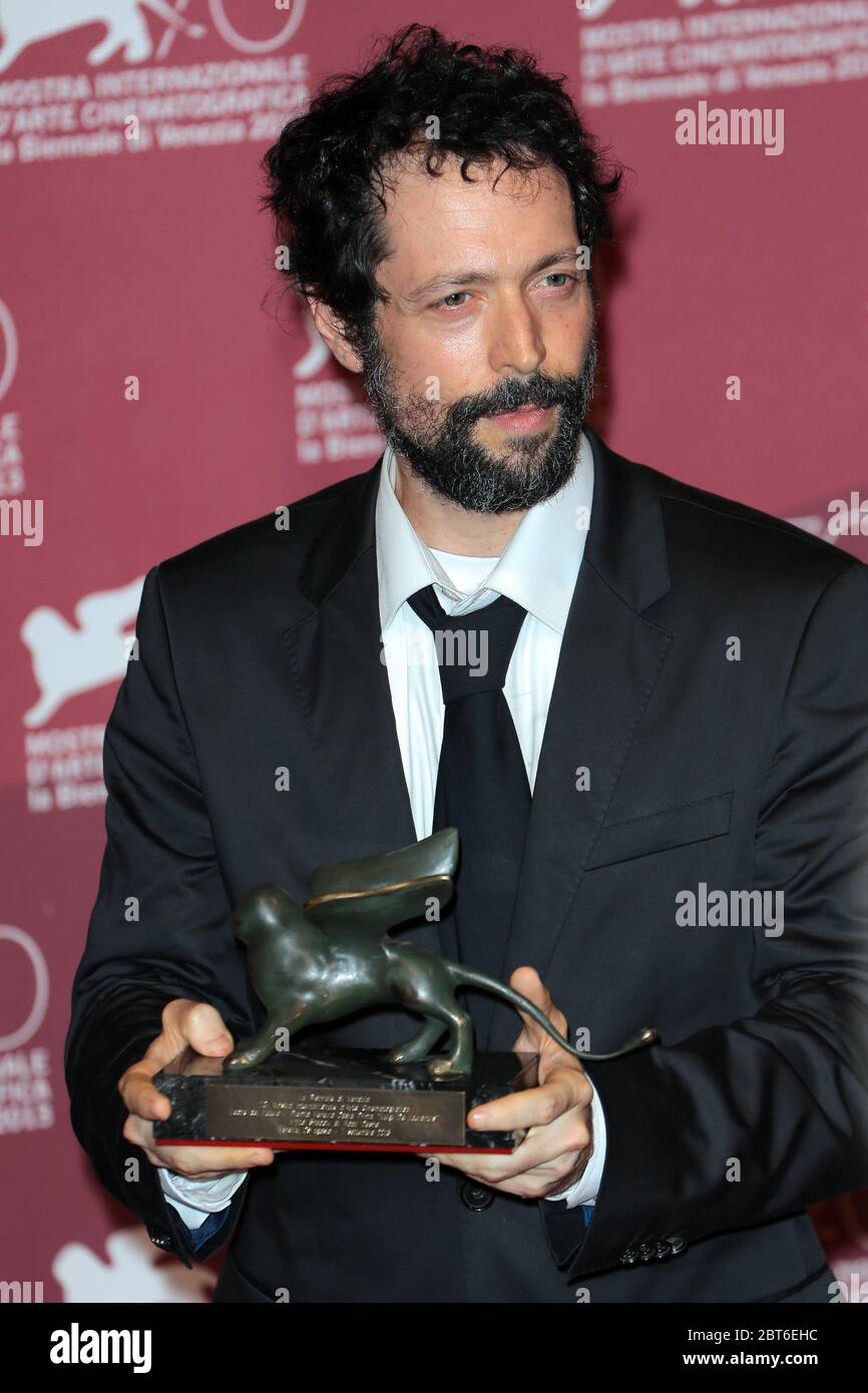 VENICE, ITALY - SEPTEMBER 07: Filmmaker Noaz Deshe poses with the Lion ...