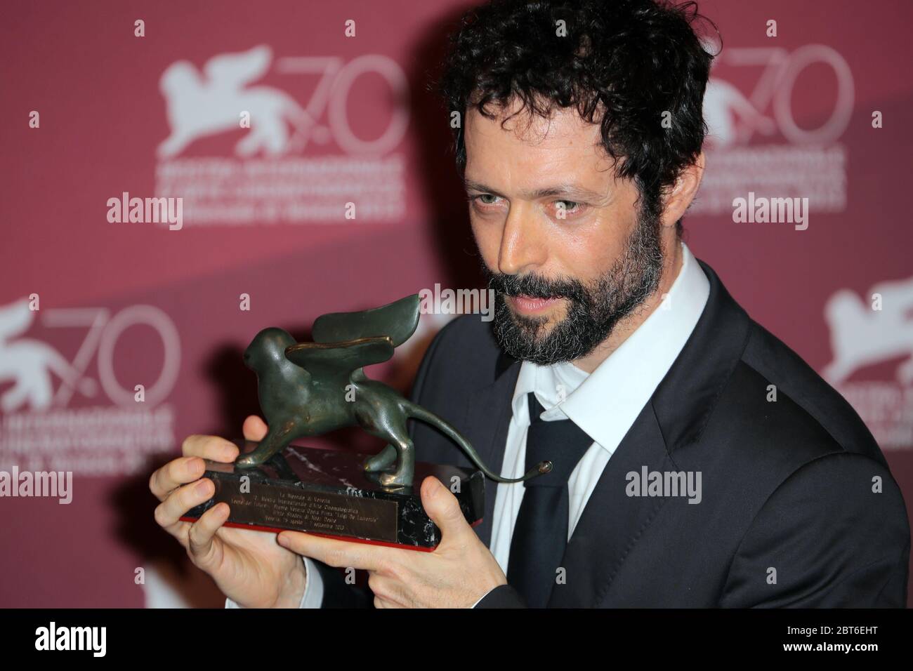 VENICE, ITALY - SEPTEMBER 07: Filmmaker Noaz Deshe poses with the Lion ...
