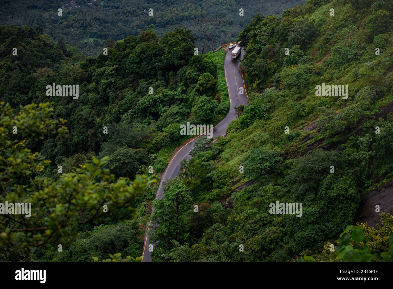 bus passing on a hill station route, mountain road landscape Stock ...
