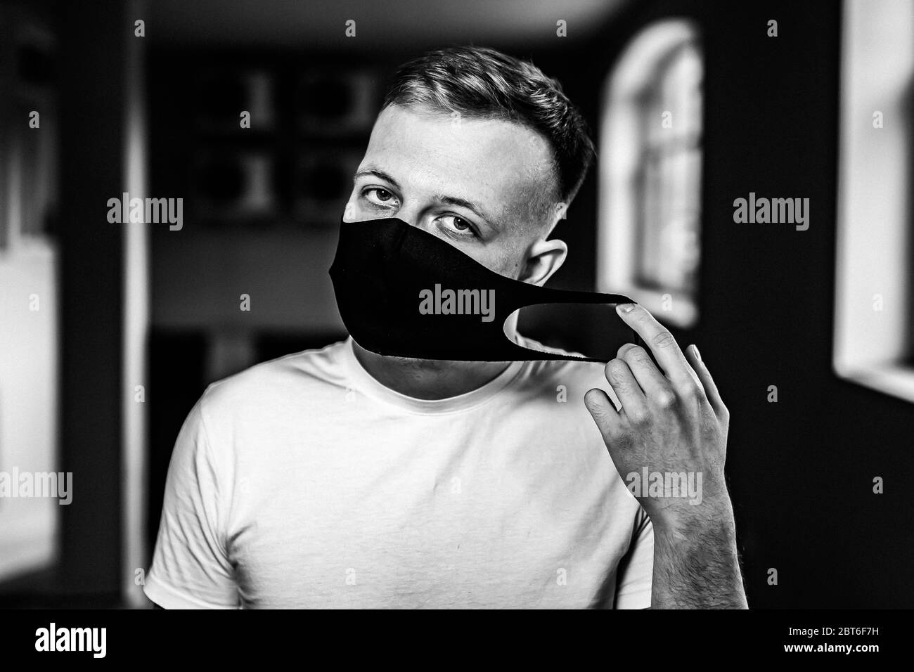 Black and white portrait of a man in a mask against the virus Stock ...