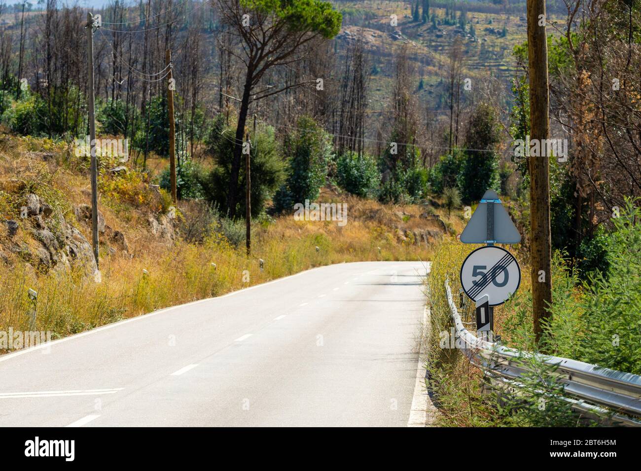 End of speed limit 50 sign on mountain road Stock Photo - Alamy