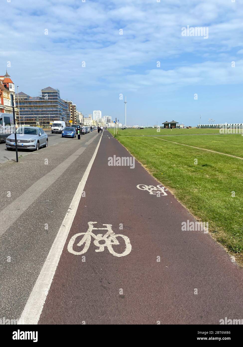 Cycle path next to a road with cars Stock Photo - Alamy