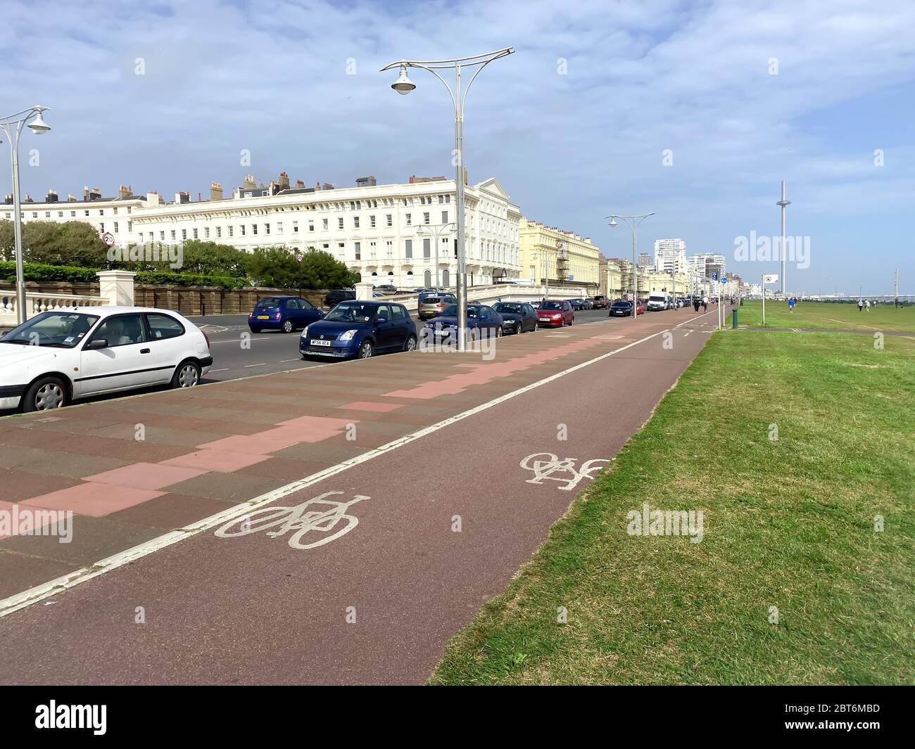 Empty cycle path next to cars Stock Photo - Alamy
