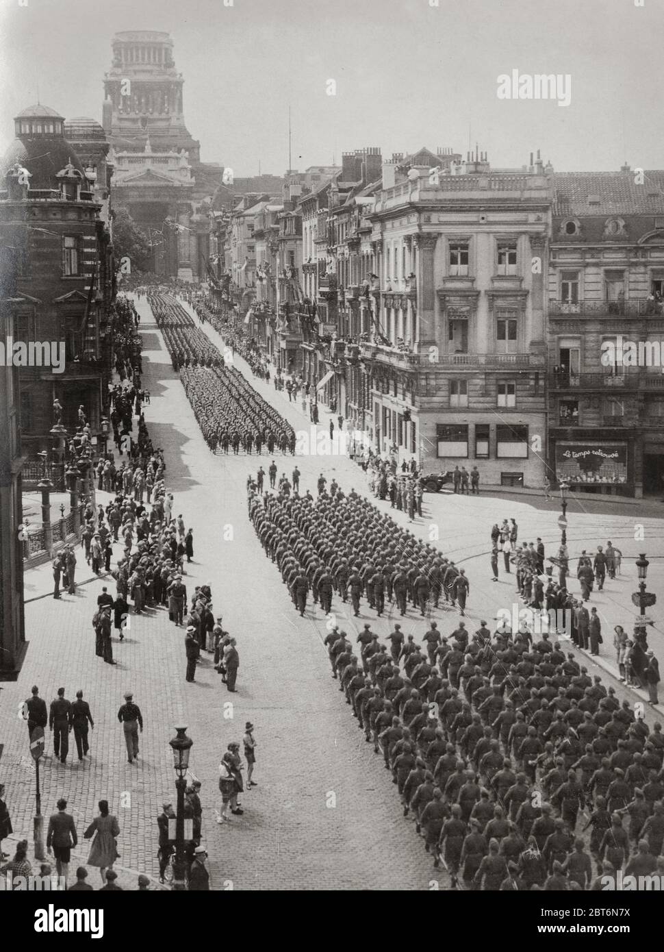 World War II vintage photograph - Allied troops march along the rue de ...
