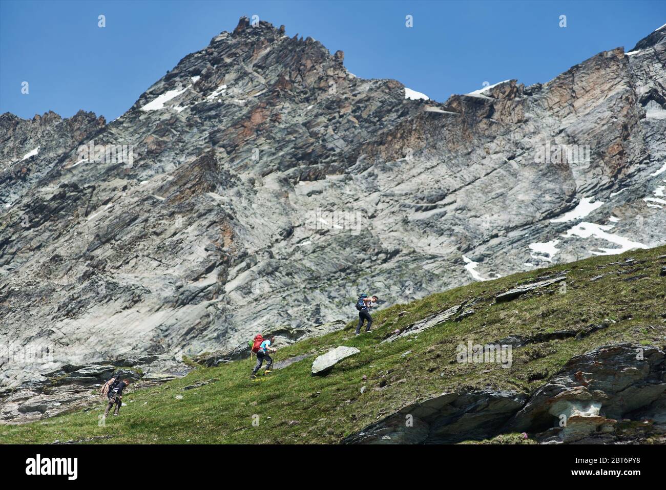 People reaching top of mountain hi-res stock photography and images - Alamy