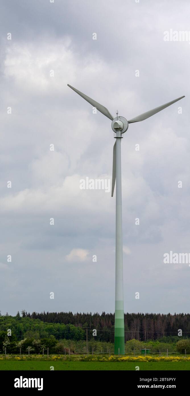 single wind turbine on a piece of meadow Stock Photo - Alamy