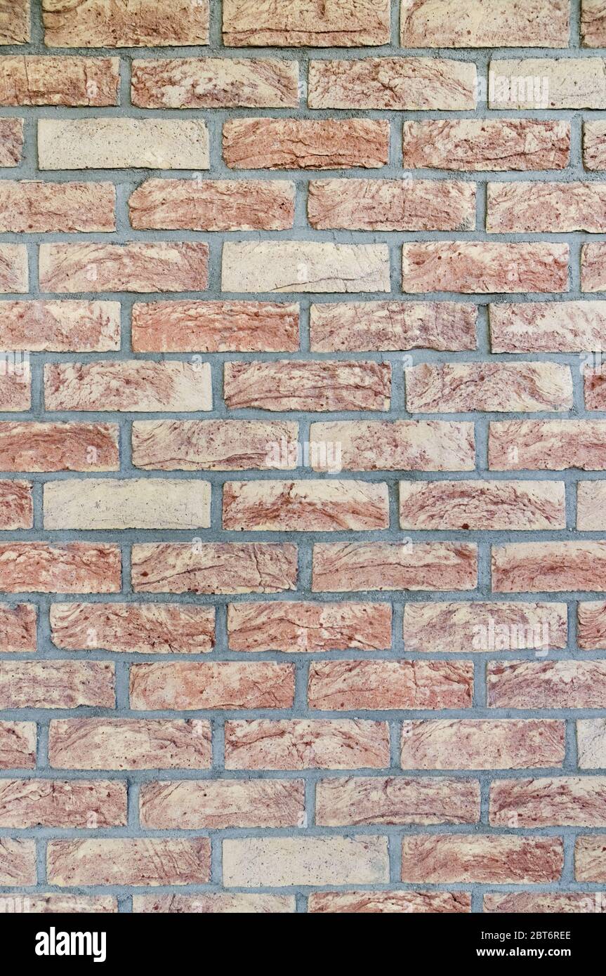 Close up of red and orange brick wall, front view, full frame ...