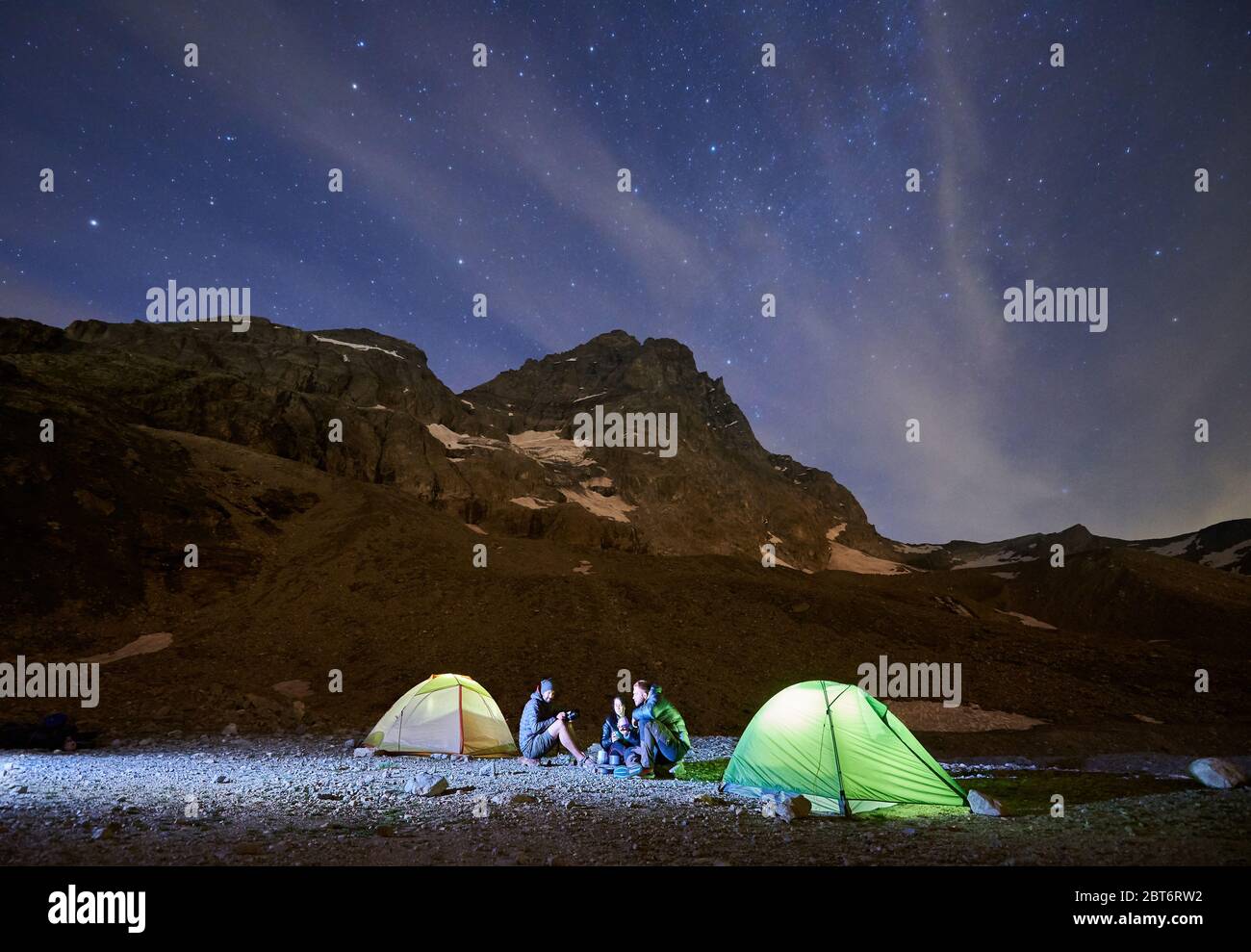 Magic scenery of blue cloudy sky and shining stars, beautiful mountains ...