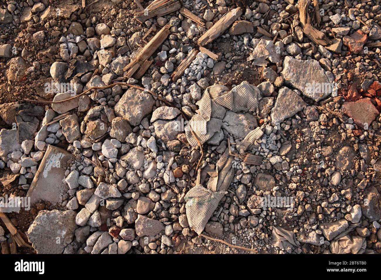 fragments of stones, the texture of nature mixed with garbage, pieces ...
