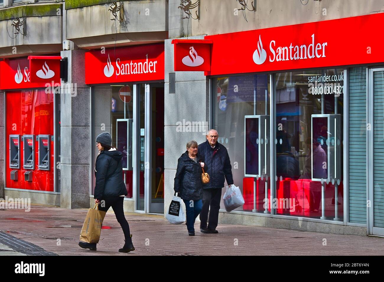 People walking past the front of the Santander Bank premises in Cardiff ...