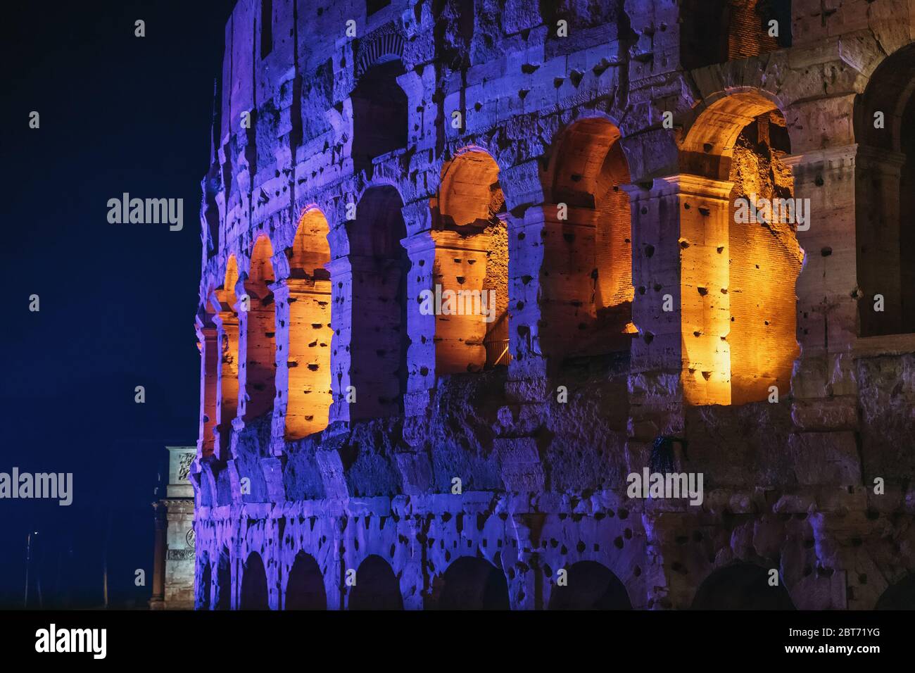Colosseum or Coliseum wall with night illumination. Huge Roman ...