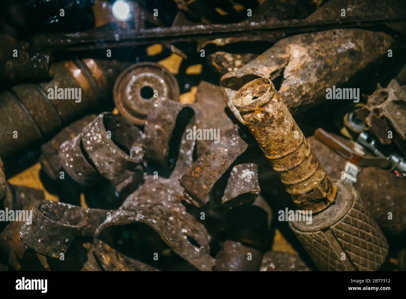 Old rusty shells, grenades and bullets of World War 2, close up ...