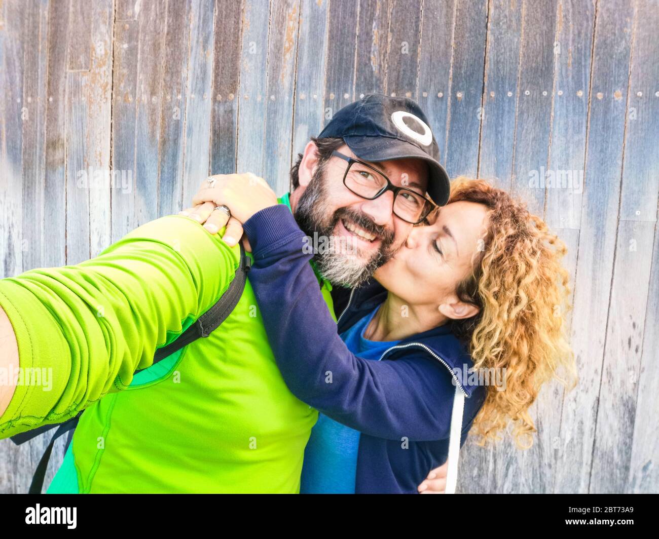 Happy caucasian adult couple in outdoor leisure activity together ...