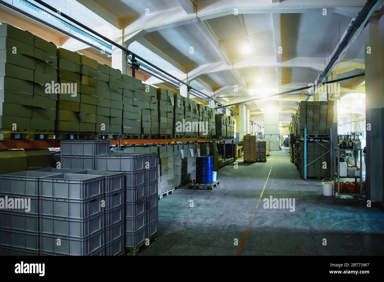 Factory warehouse interior inside with rows of shelves with boxes Stock ...