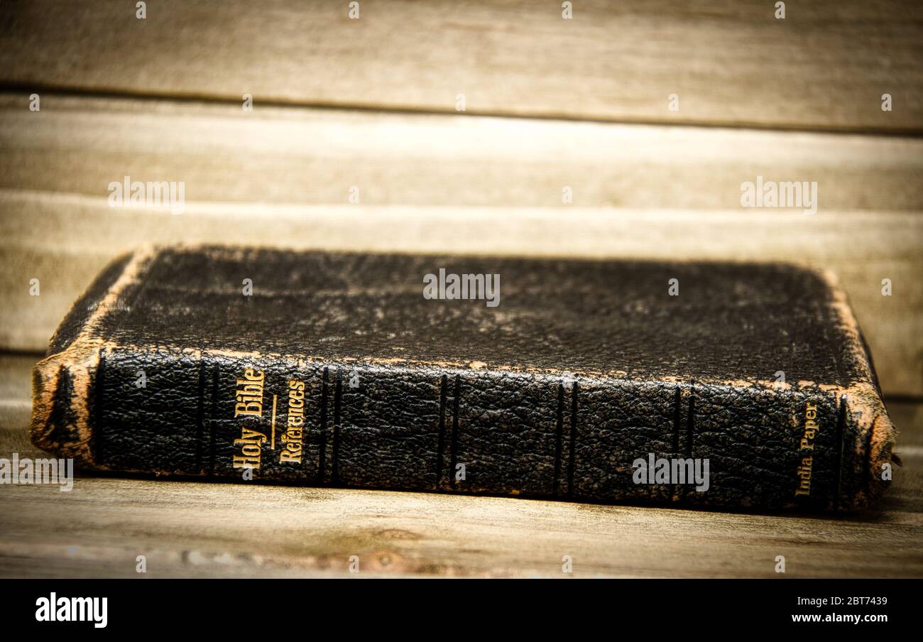 Bible Resting on a Wood Table Stock Photo - Alamy