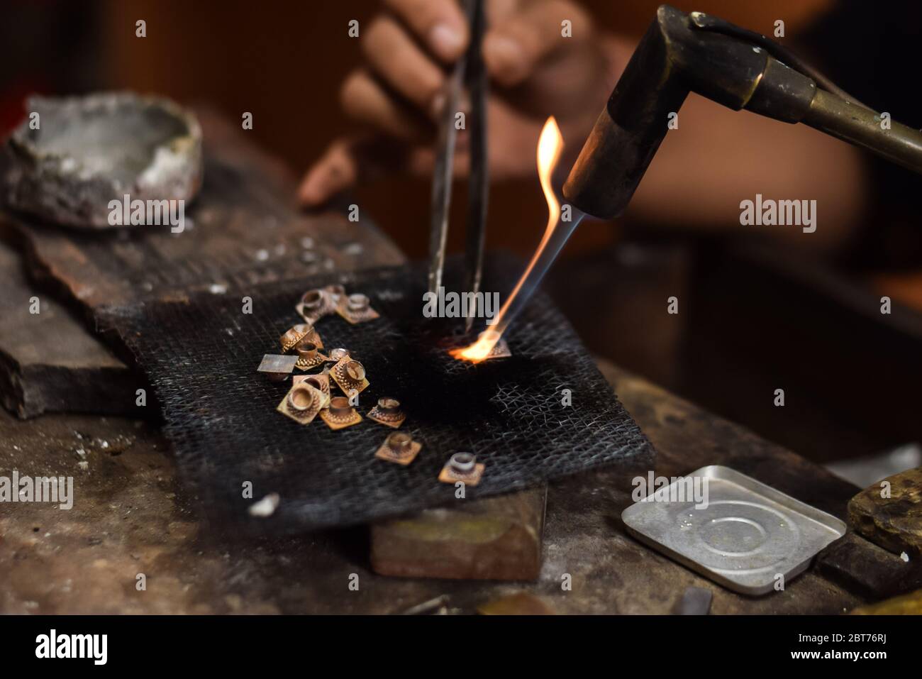 Person melting silver jewellery hi-res stock photography and images - Alamy