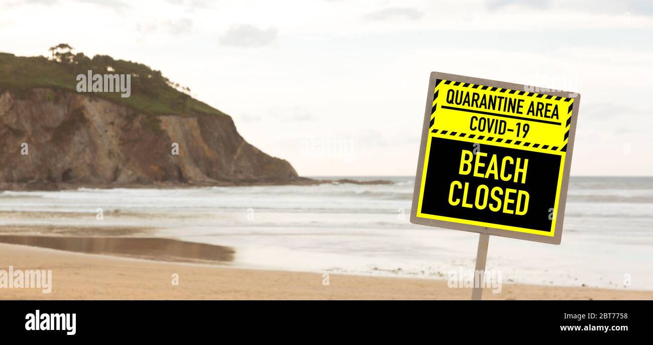 Beach with a information sign indicating that it is closed for ...