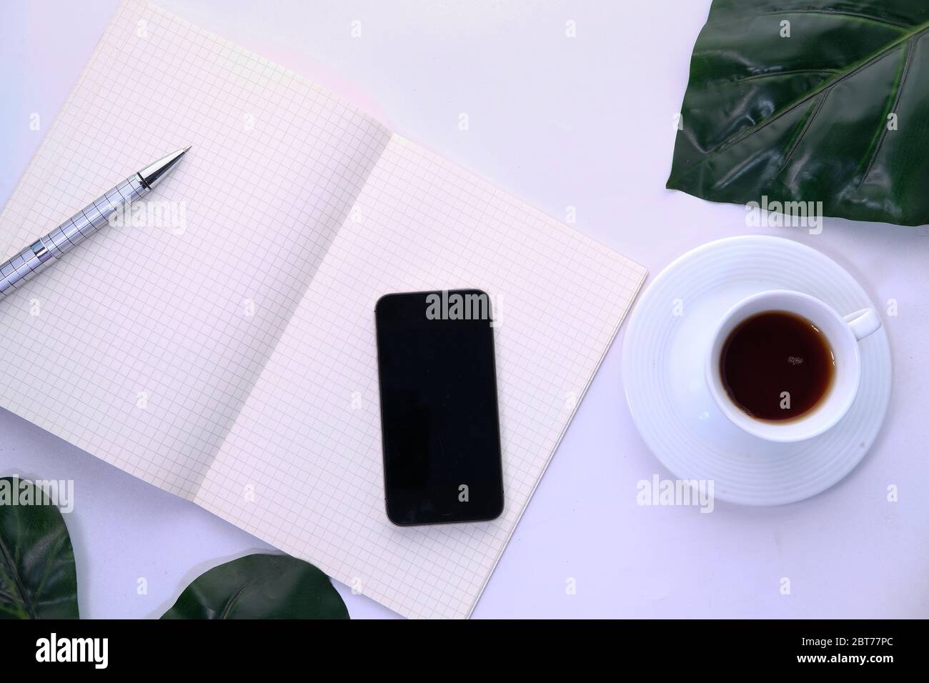 smart phone with empty screen and notepad on wooden background Stock ...