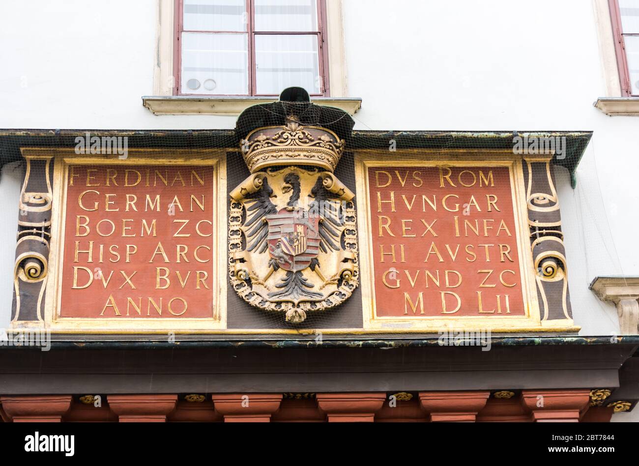 Crown on the wall of the Hofburg, the former principal imperial palace ...