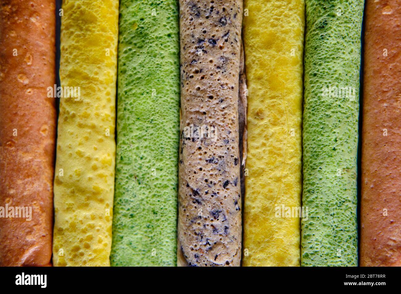 Pancakes of different color. Spinach, beetroot powder, blueberry and ...