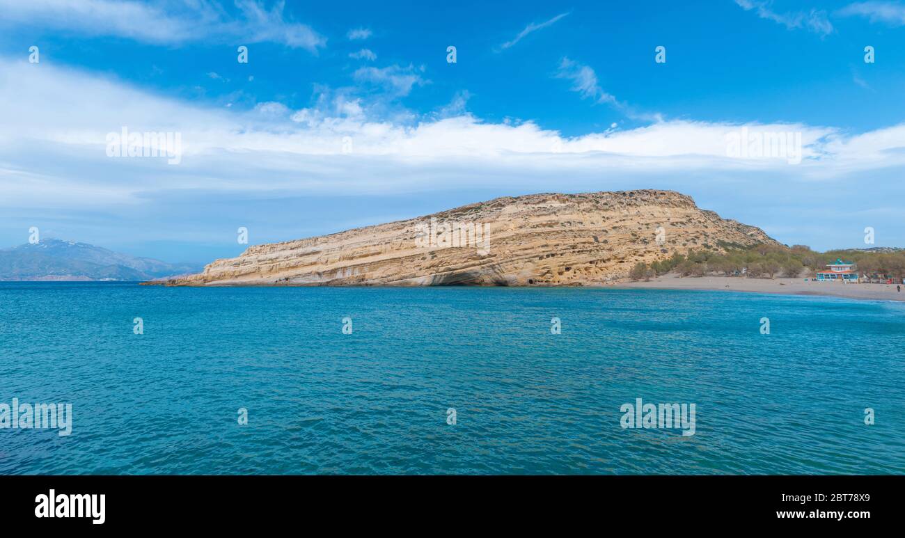 Panorama of Matala, beautiful beach on Crete island, waves and rocks ...