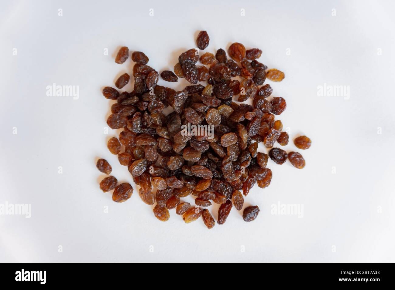 dry raisins isolated from dry fruits pot Stock Photo - Alamy