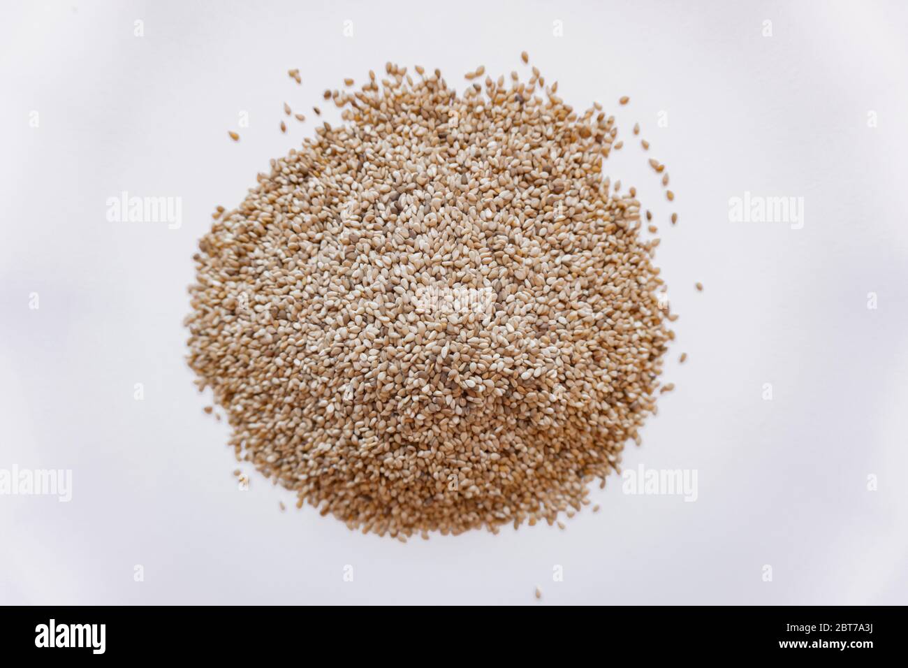 sesame seeds isolated natural color grains Stock Photo - Alamy