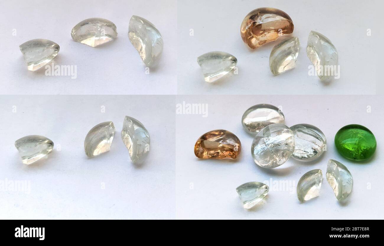 broken glass transparent stones on a white background. set of shards ...