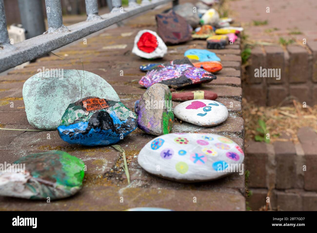 Painted stones on a wall in Duisburg-Orsoy, so called Corona stones ...