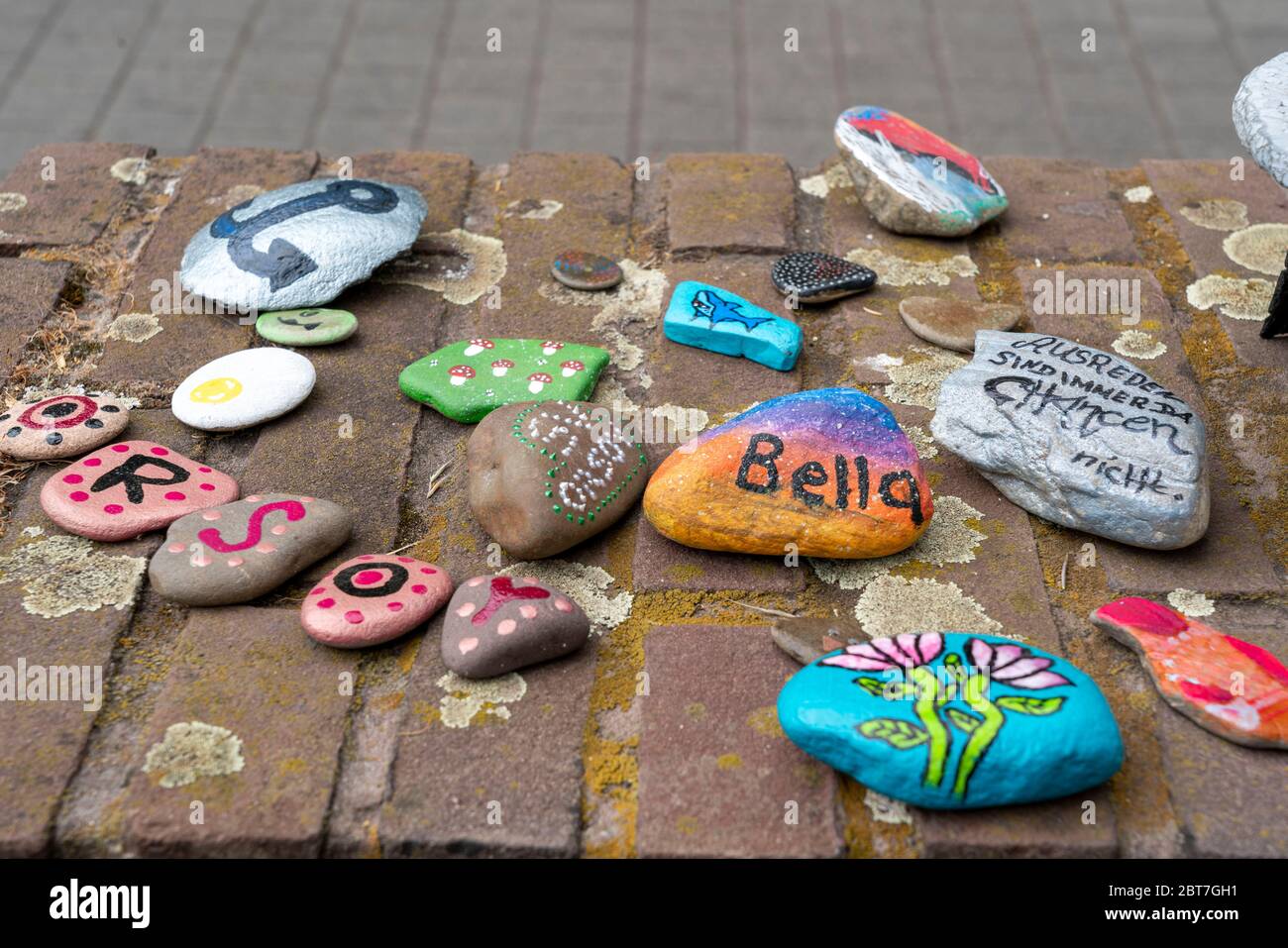 Painted stones on a wall in Duisburg-Orsoy, so called Corona stones ...
