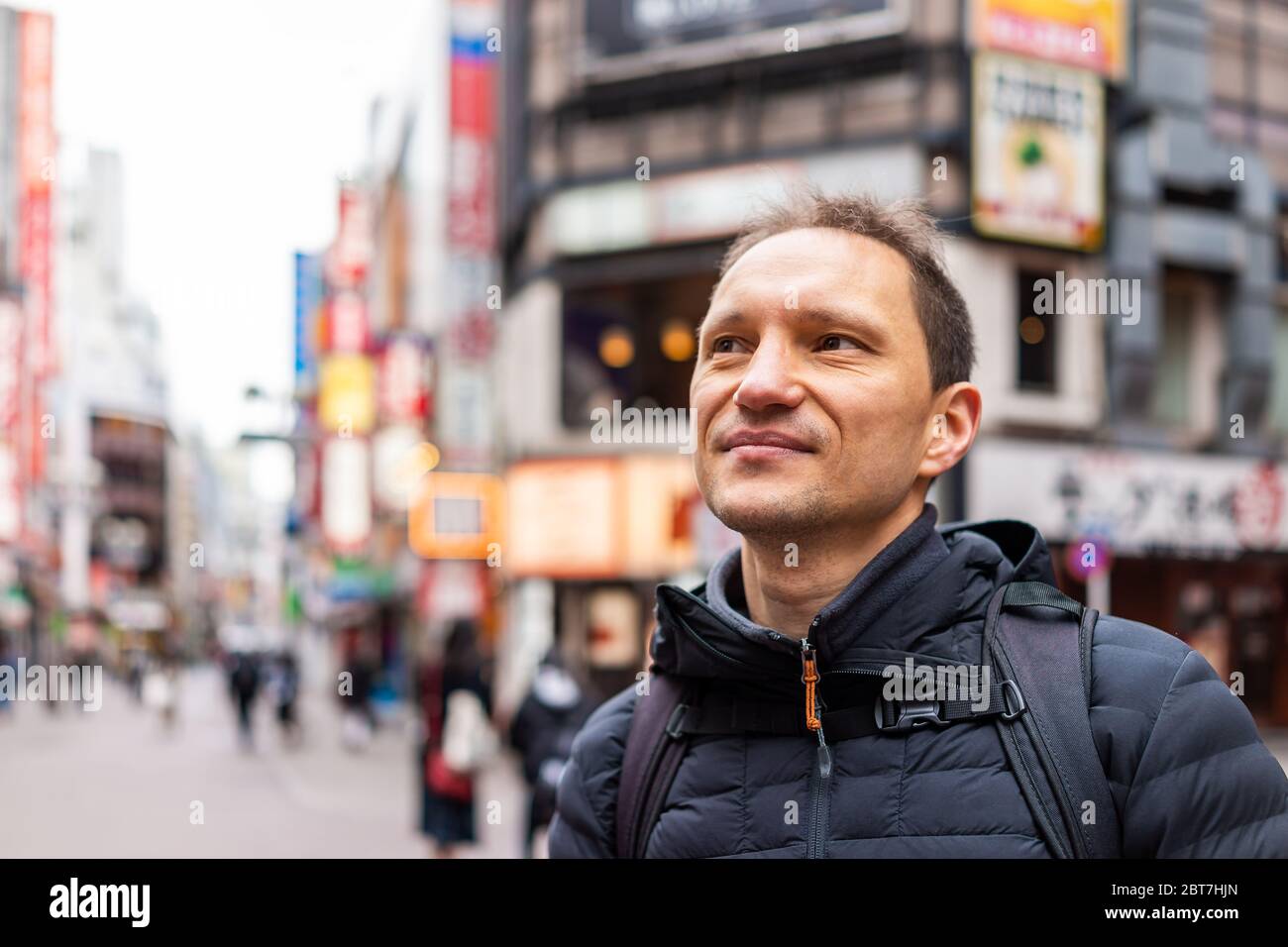 Tokyo, Japan Shibuya ward with closeup of happy man tourist in famous ...