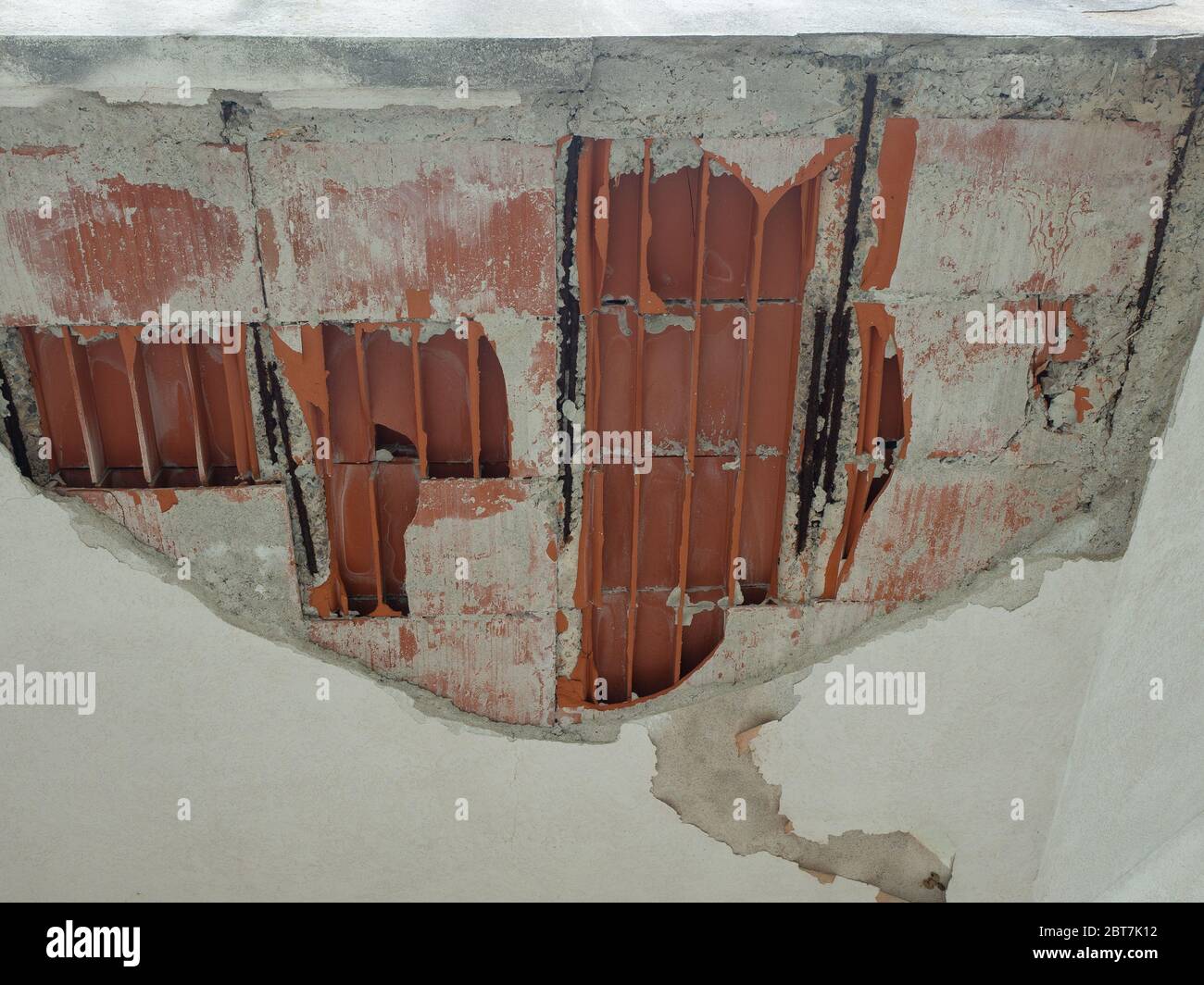 Ceiling Damaged after a weak earthquake, cement plaster and brick have ...