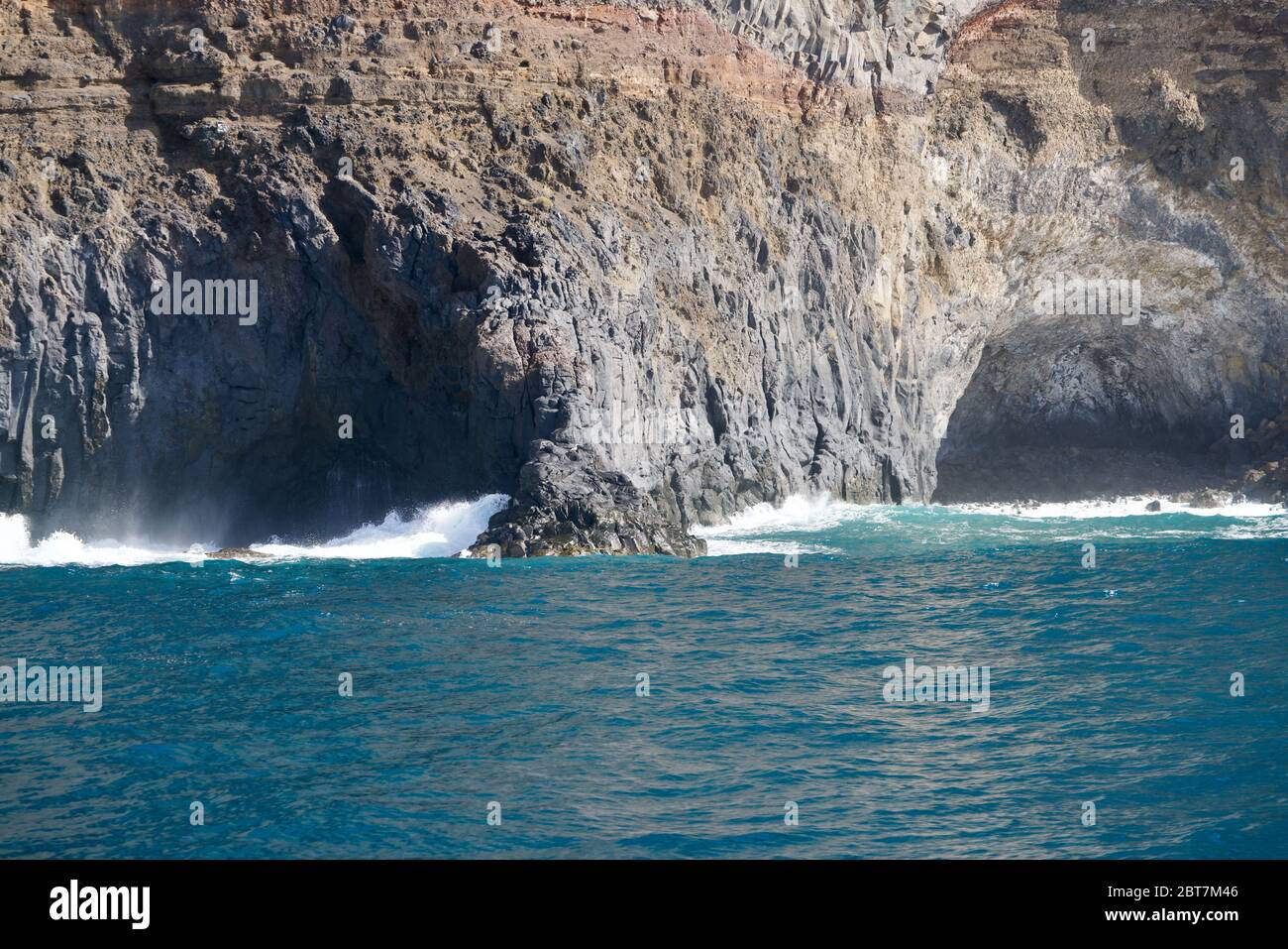 holes in a cliff at the sea Stock Photo - Alamy