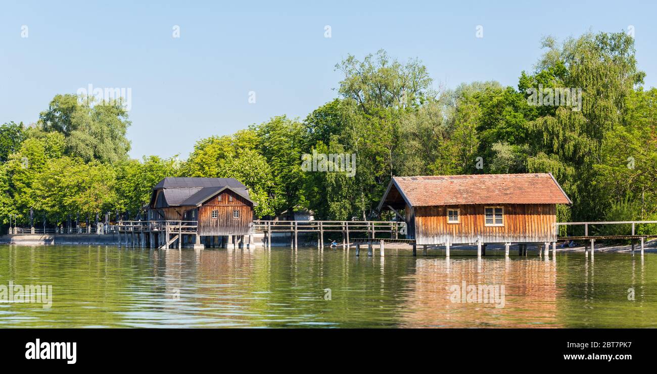 Wooden boat houses at Ammersee (Lake Ammer) duing springtime. Popular ...